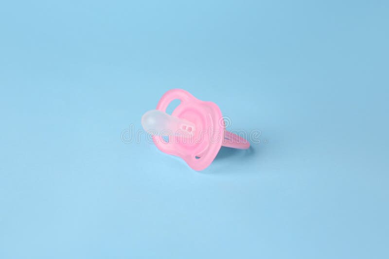 One New Baby Pacifier on Light Blue Background Stock Photo - Image of ...