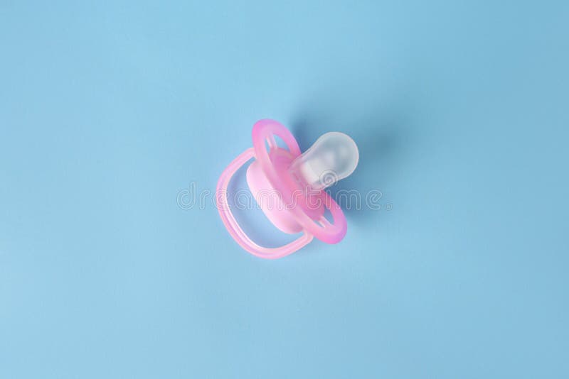 One New Baby Pacifier on Light Blue Background, Top View Stock Photo ...