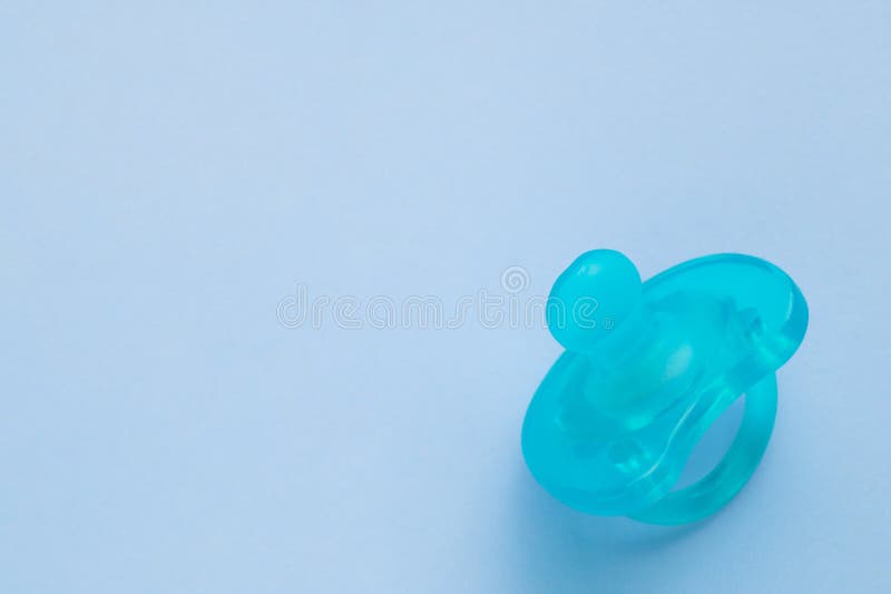 One New Baby Pacifier on Light Blue Background, Top View. Space for ...