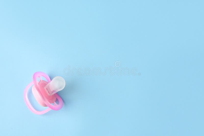 One New Baby Pacifier on Light Blue Background, Top View. Space for ...