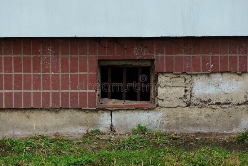 One Old Basement Window with a Rusty Bars on the Brown Wall Stock Photo ...