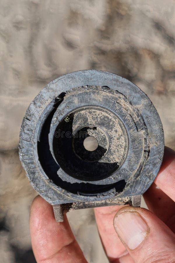 One Old Black Round Plastic Cap Lies of a Hand Stock Photo - Image of ...