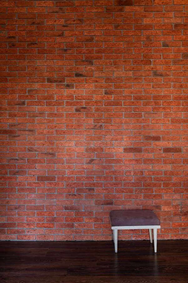 One Old Vintage Chair in the Interior of a Room with a Brick Wall Stock ...