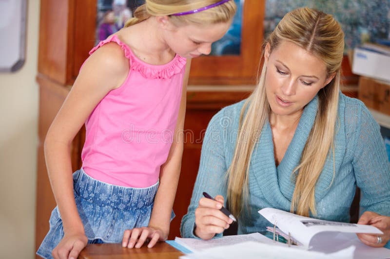One on One Learning. a Young Teacher Explaining Work To a Student in ...