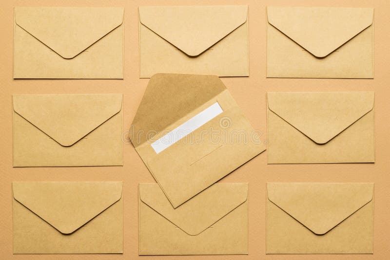 An Open Postal Envelope with a Sheet of White Paper and a Closed ...