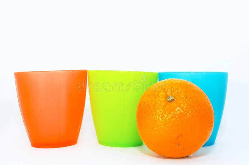 One orange fruit and cups stock photo. Image of fruity - 994684