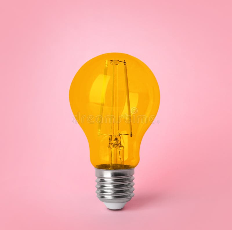 One Orange Light Bulb on Pink Background Stock Image - Image of color ...