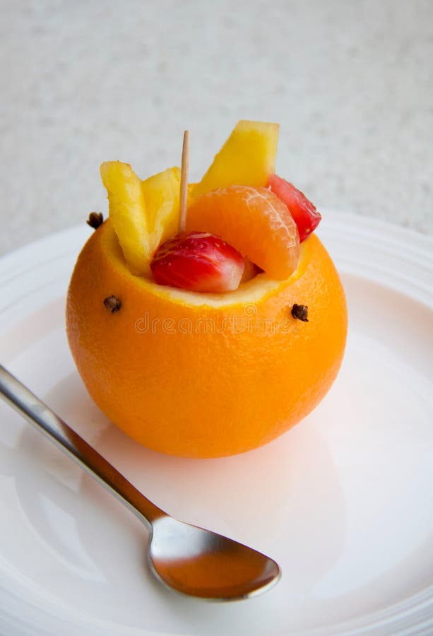 One Orange Stuffed Decorated with Cloves and Fruit Salad Stock Photo ...