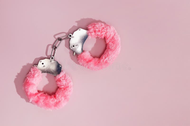 The Toy Handcuffs are Pink on a White Background Stock Image - Image of ...