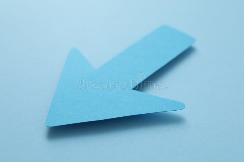 One Paper Arrow on Light Blue Background, Closeup Stock Image - Image ...