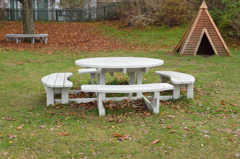 One Park Bench with a Table Stock Image - Image of garden, plant: 68072285