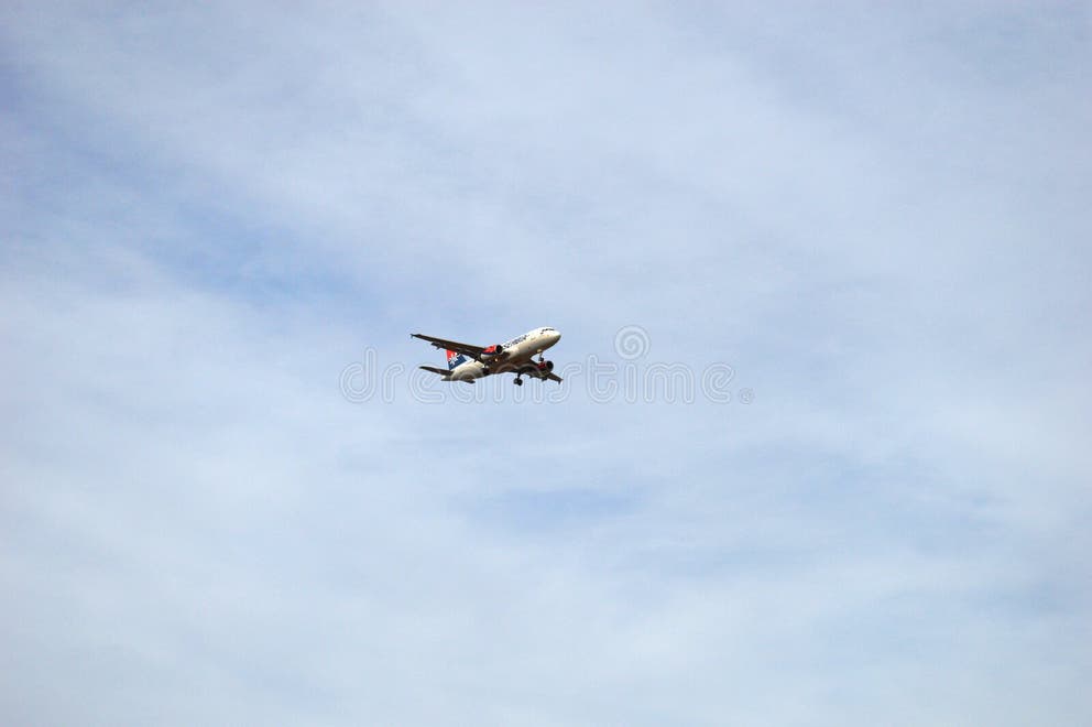 Passenger plane in flight editorial photography. Image of travel ...