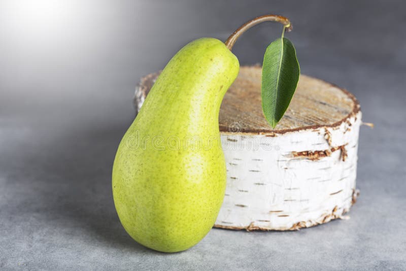 One Pear with Green Leaf on the Table. Stock Image - Image of green ...