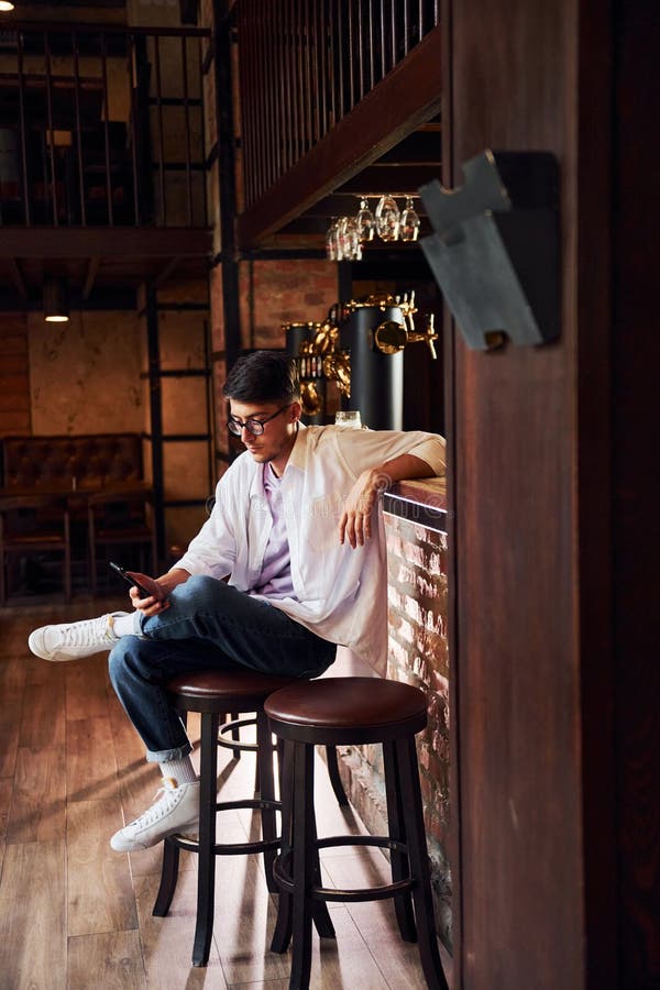 One Person. Man in Casual Clothes Sitting in the Pub Stock Photo ...
