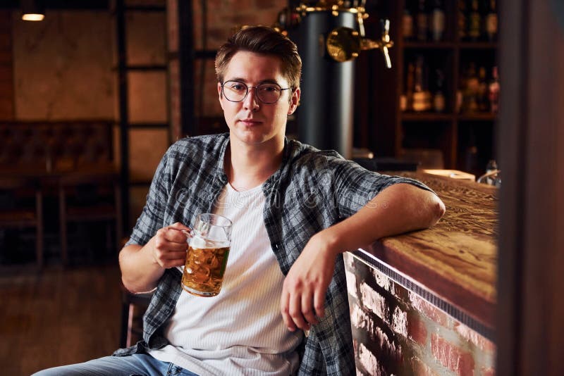 One Person. Man in Casual Clothes Sitting in the Pub Stock Photo ...
