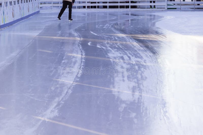 One Person is Skating on the Rink. Thin Sunbeams on Ice Stock Image ...