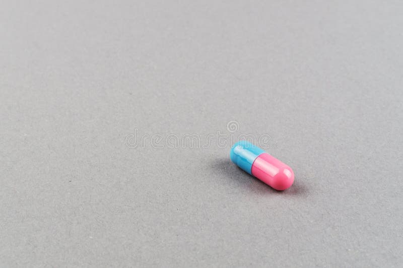 One Pill Colored in Pink and Blue with Copy Space Stock Photo - Image ...