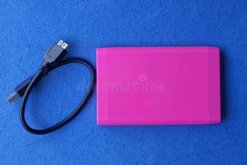 One Pink Plastic Drive and a Black Usb Cable Stock Photo - Image of ...