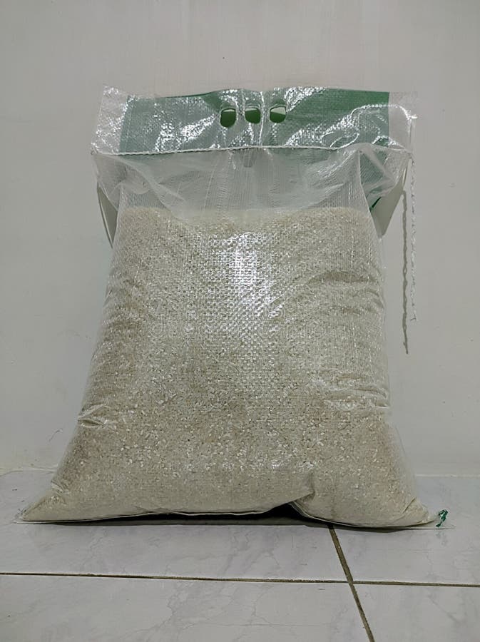 One Plastic Sack of Rice on the Tiled Floor Stock Photo - Image of ...