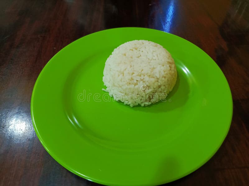 One Portion of Rice on Green Plating Stock Image - Image of green, rice ...