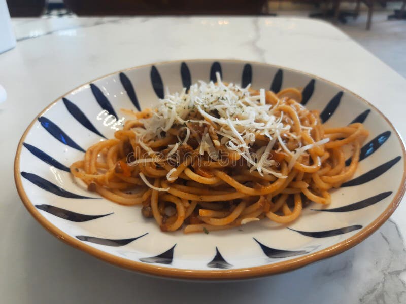 A Portion of Spaghetti Bolognese Stock Photo - Image of basil, dinner ...