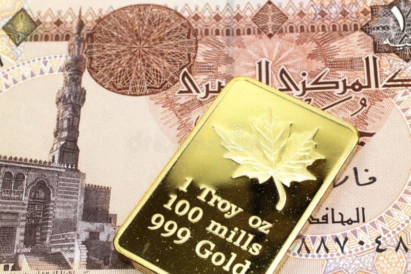 A One Pound Egyptian Pound Note with a Gold Bar in Macro Stock Image ...
