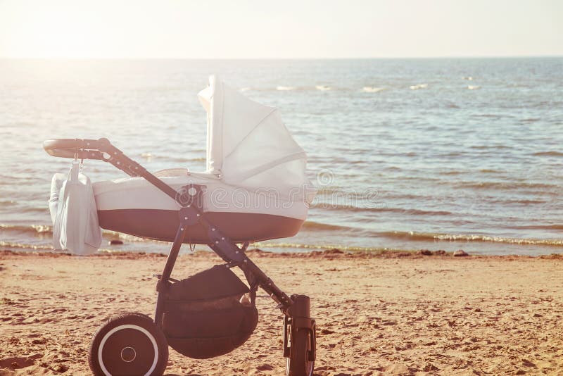 One pram baby on beach stock photo. Image of concept - 106210214