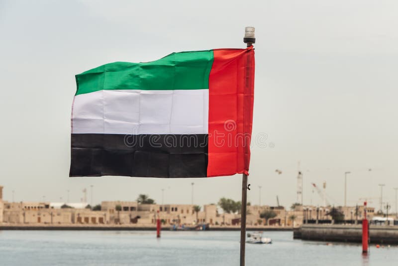 One Rectangular Red Colored Flag with Yellow Stars is on a Blue Sky ...