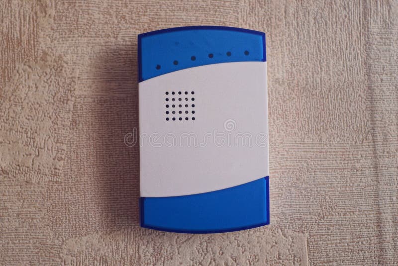One Rectangular Plastic White Blue Bell Box Hanging on a Brown Wall ...