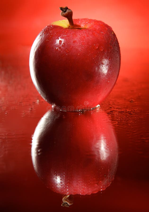 Apple in the mirror image stock photo. Image of brainchild - 36692732