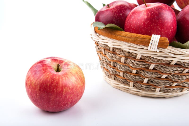 One Red Apple and Basket with Apples Stock Photo - Image of fruit ...