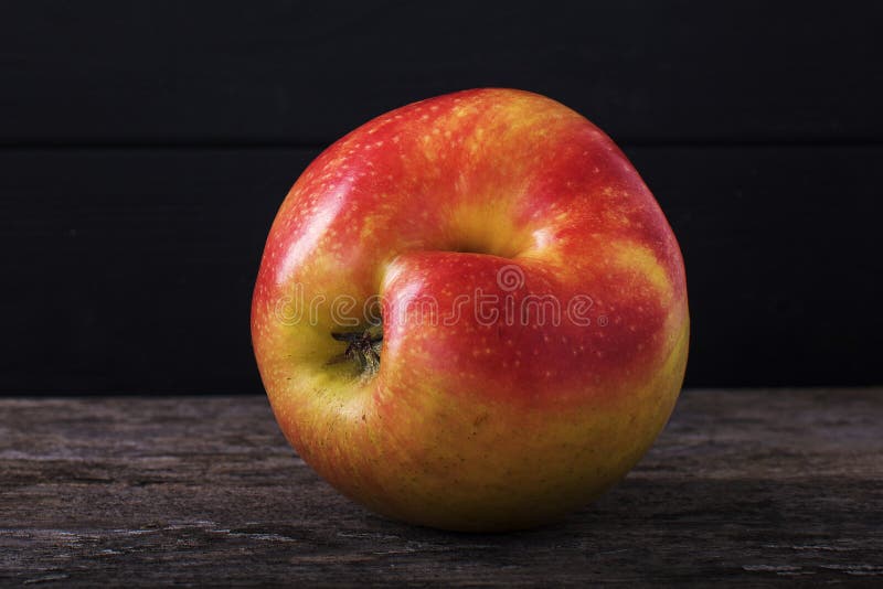 One Red Apple Close Up and Copy Space on the Background of a Rusty ...