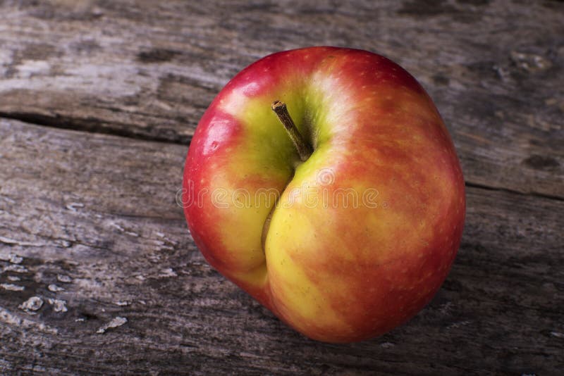 One Red Apple Close Up and Copy Space on the Background of a Rusty ...
