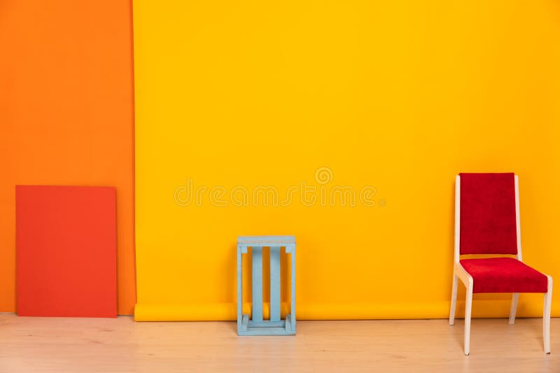 One Red Chair Against a Yellow-orange Wall Stock Image - Image of ...