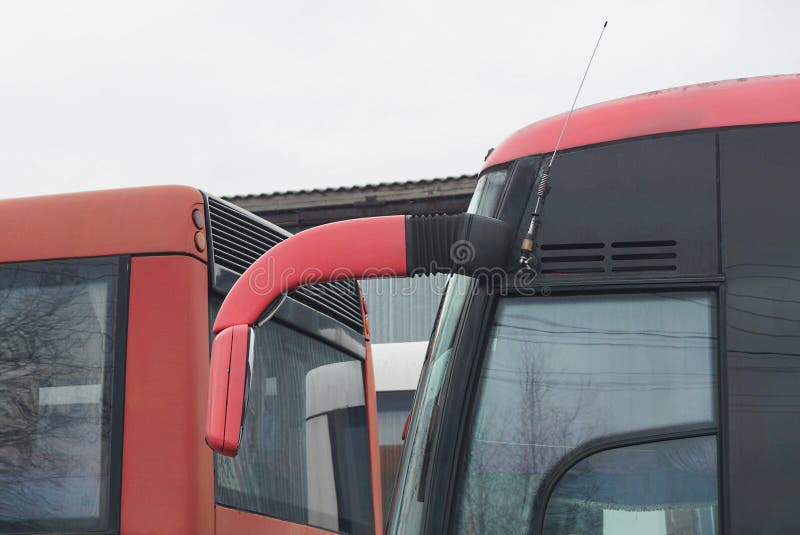 One Red Front Long Plastic Viewing Mirror on a Black Bus Stock Photo ...