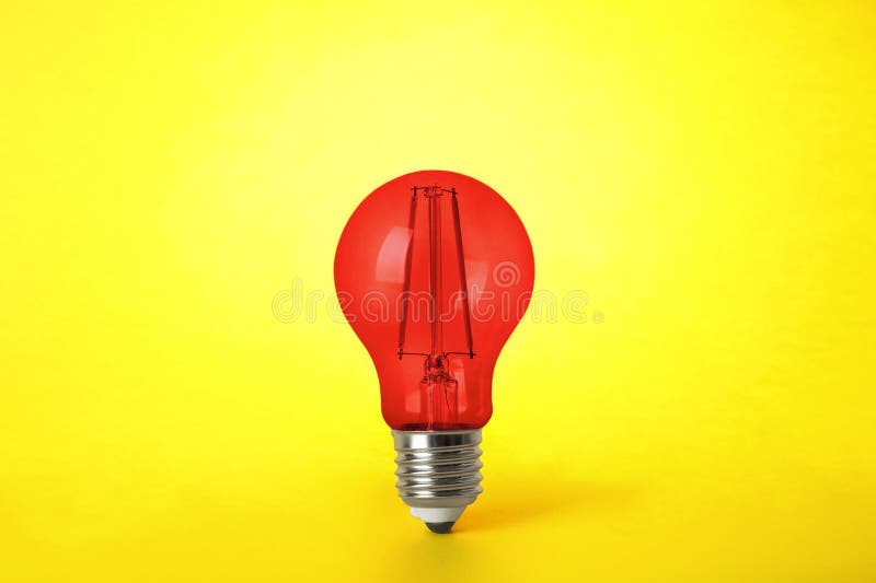 One Red Light Bulb on Yellow Background Stock Image - Image of lamp ...