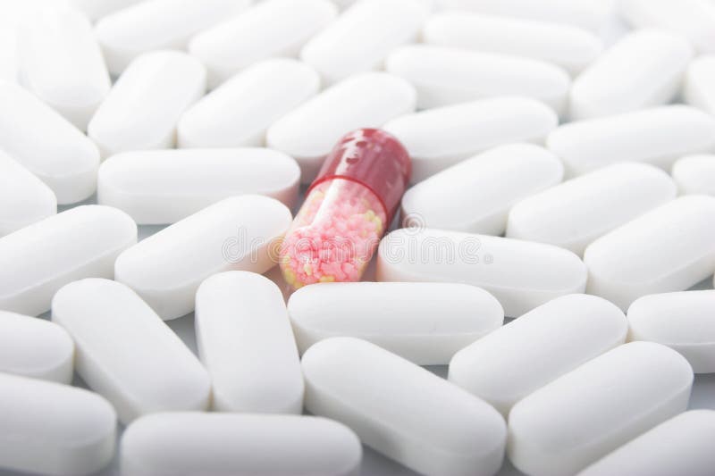 One Red Pill in Many White Pills Stock Photo - Image of pills ...