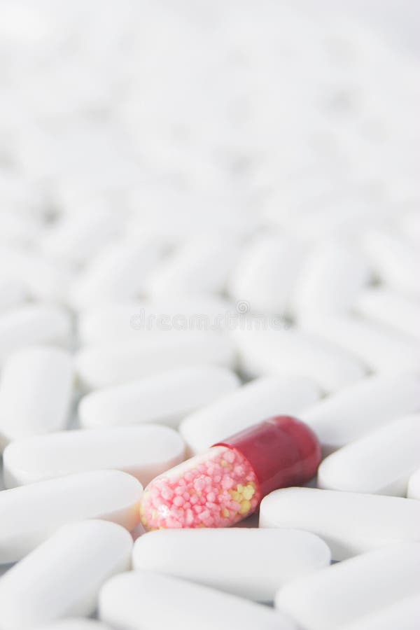 One Red Pill in Many White Pills Stock Image - Image of medication ...