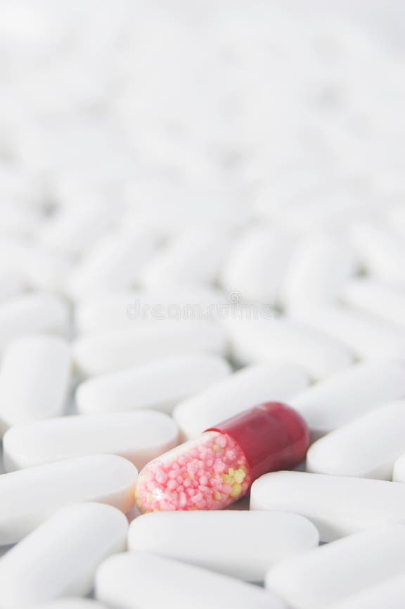 One Red Pill in Many White Pills Stock Image - Image of medication ...
