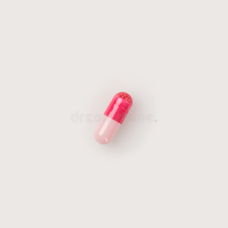 One red and pink pill stock photo. Image of disease - 103989894
