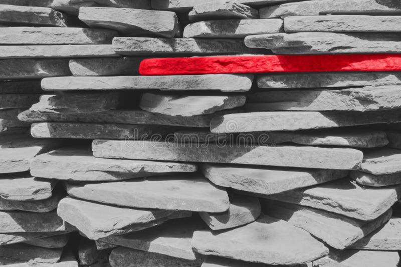 One Red Stone Against a Background of Gray Stones Stock Photo - Image ...
