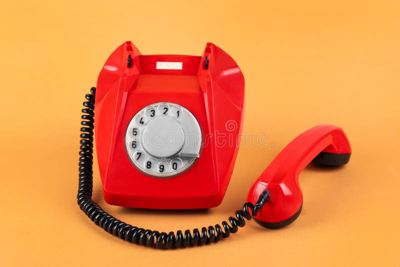 One Red Telephone with Handset on Pale Orange Background Stock Image ...
