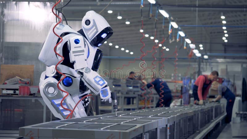 Human Factory Worker and a Robot are Walking Together in Factory ...