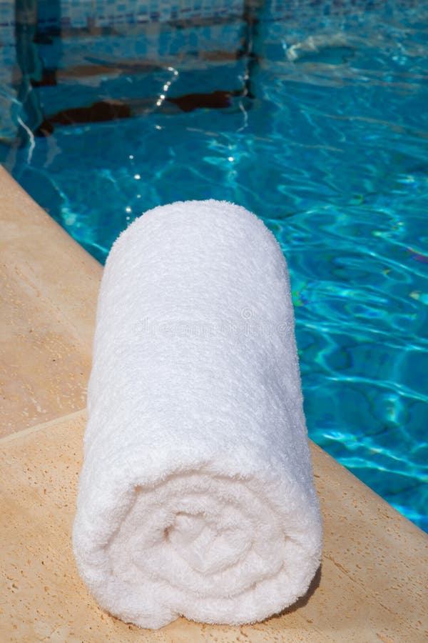 One Rolled-up White Towel by Blue Pool Stock Image - Image of bathroom ...