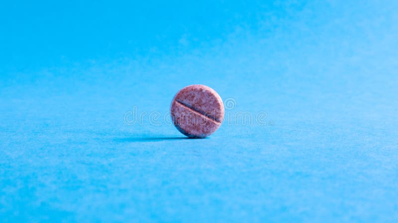 One Round Small Pill on a Blue Background in the Center with Empty ...