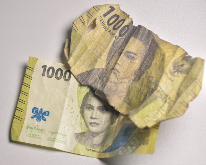 One 1000 Rupiah Battered Bank Note and Another One in a Better ...