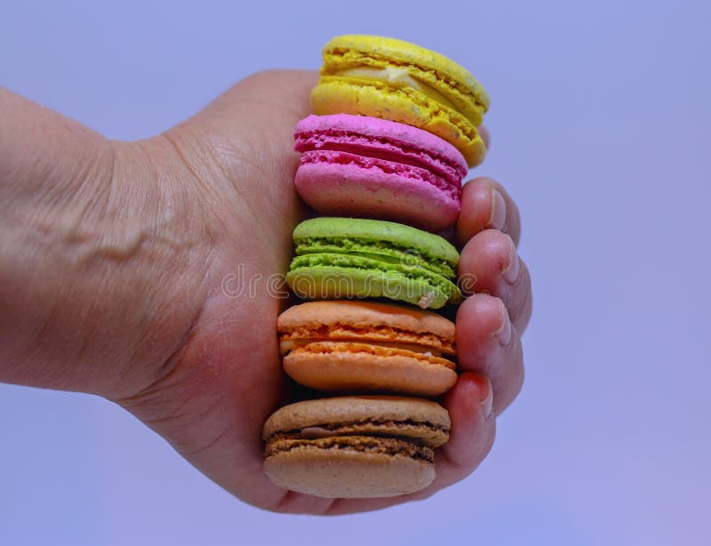 One`s Hand Holding Colorful Macarons. Stock Image - Image of decoration ...