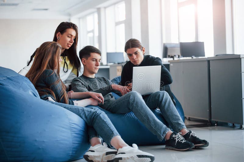 This One`s Looks Nice. Group of Young People in Casual Clothes Working ...