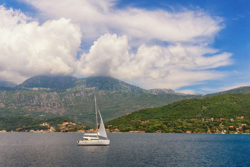 One sail boat stock photo. Image of mountainside, gulf - 75383048