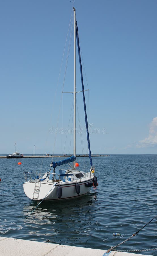 One Sailboat Moored at Sea stock photo. Image of color - 27616404